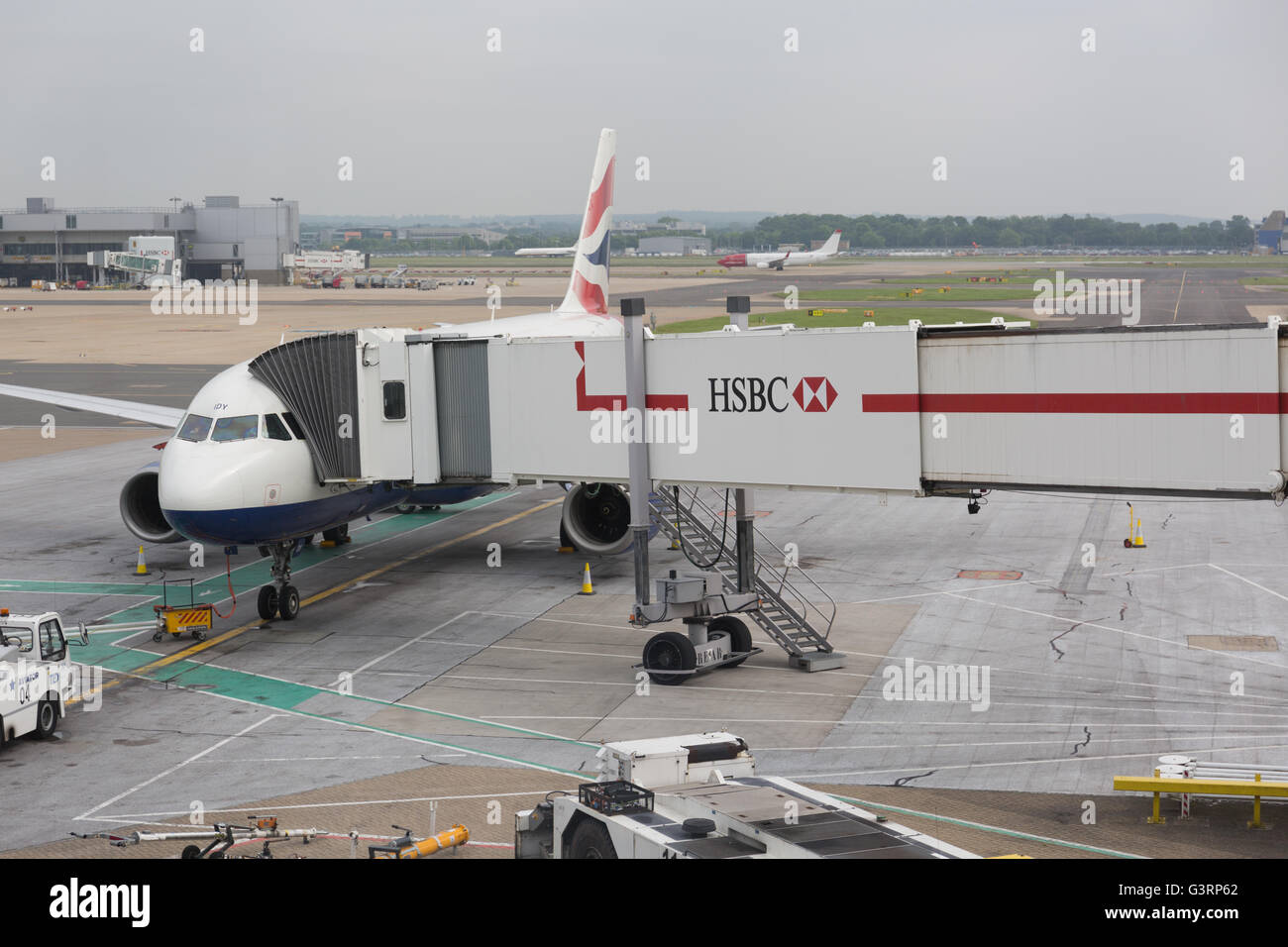 British Airways plane at the jet bridge at London Gatwick airport Stock ...