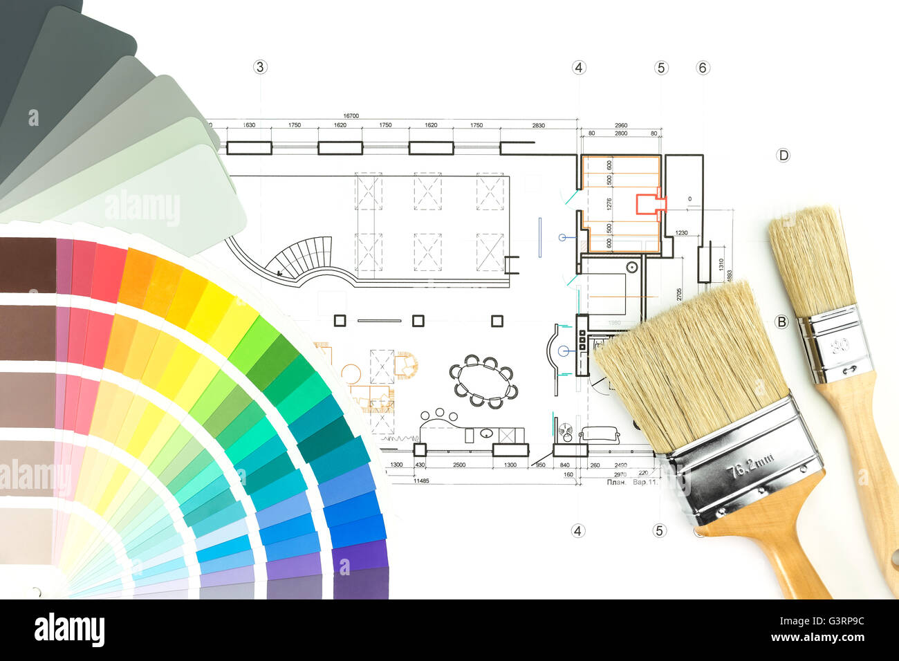 Paintbrushes and colorful paint samples on house plan blueprint ...