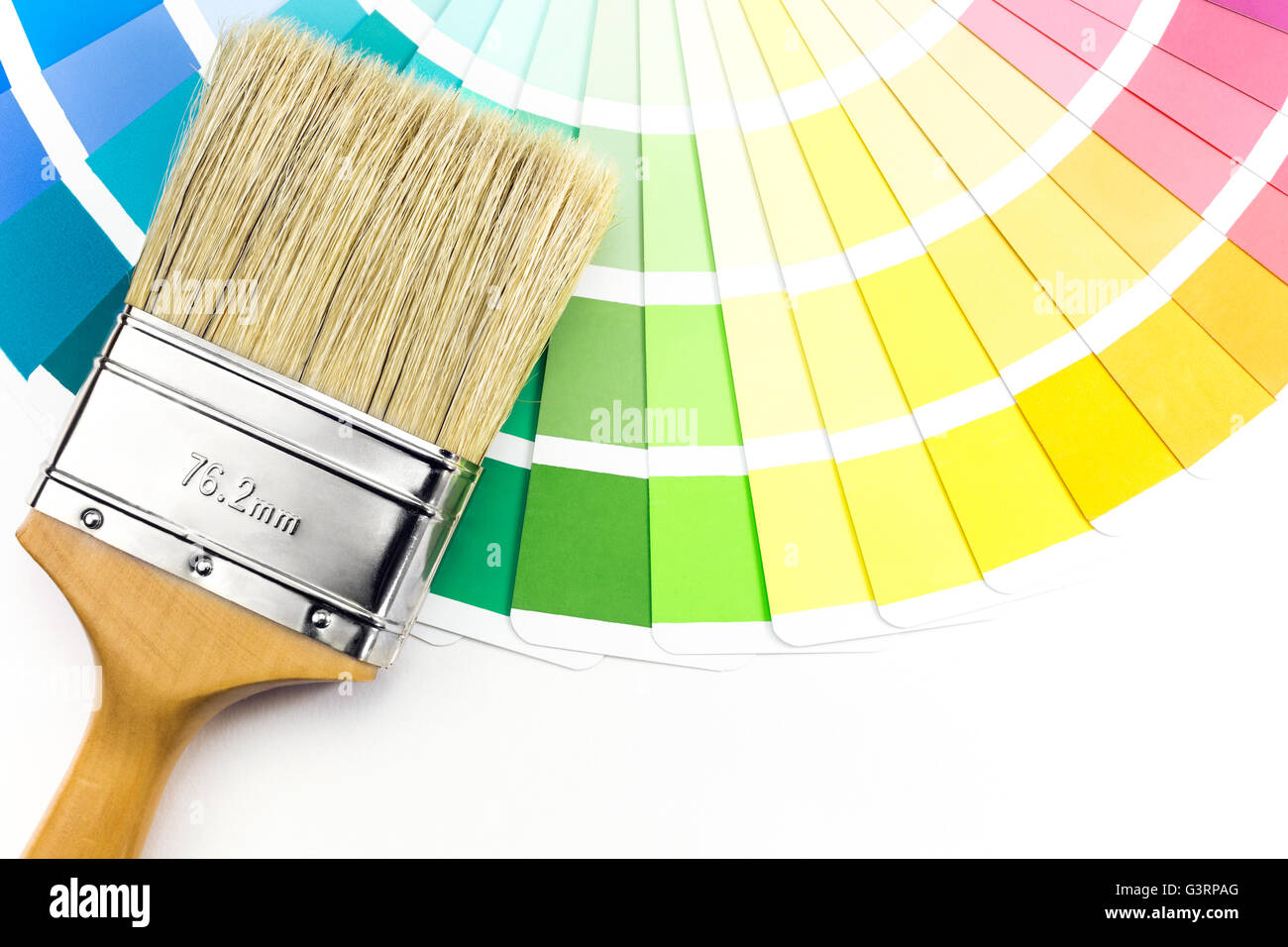 Paintbrush and colorful paint samples on white background with copy ...