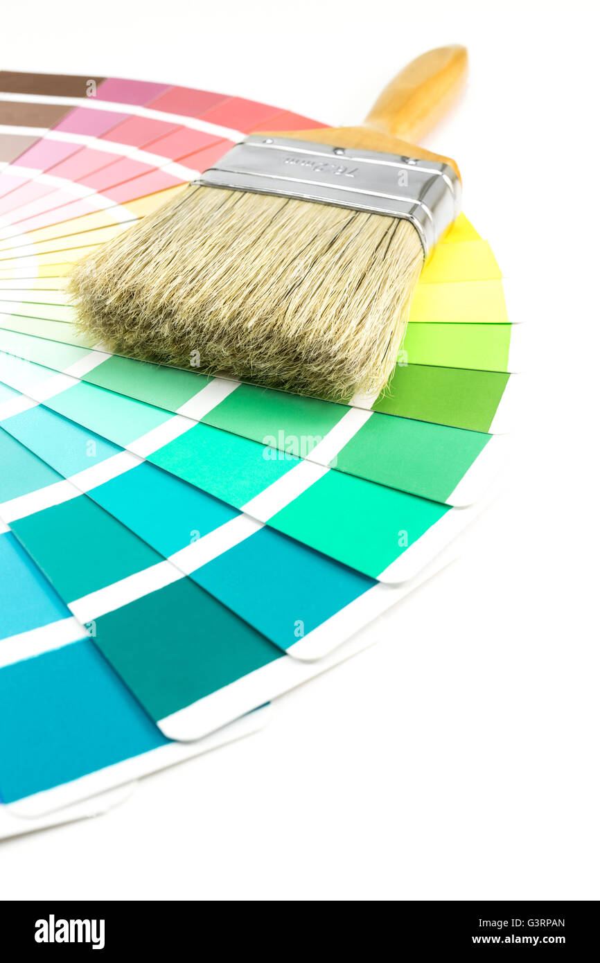 Paintbrush and colorful paint samples on white background with copy ...