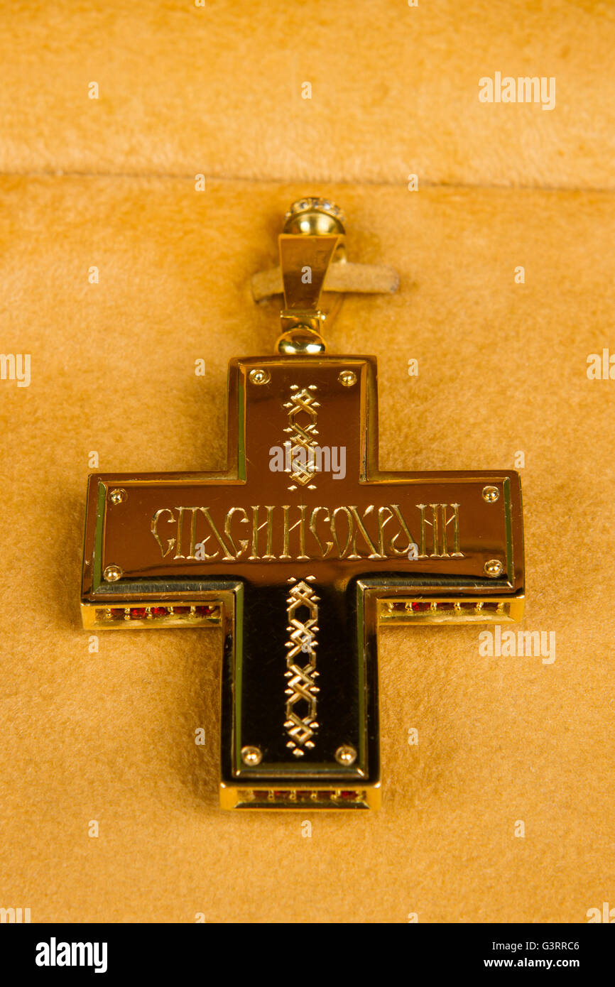 cross with the icon in the center on a brown background Stock Photo - Alamy