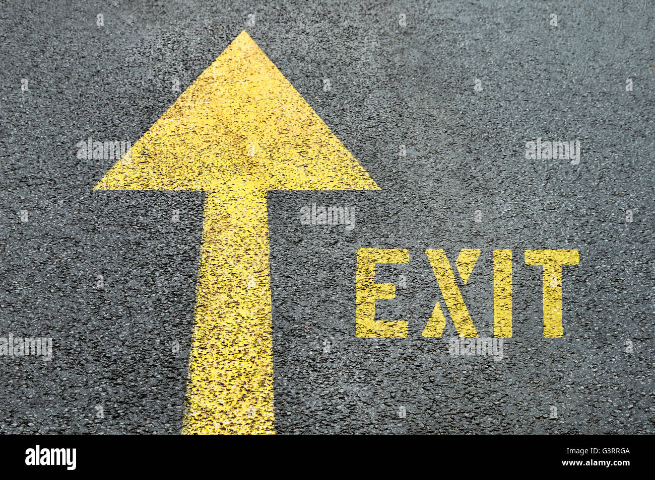 Yellow forward road sign with Exit word on the asphalt road. Business ...