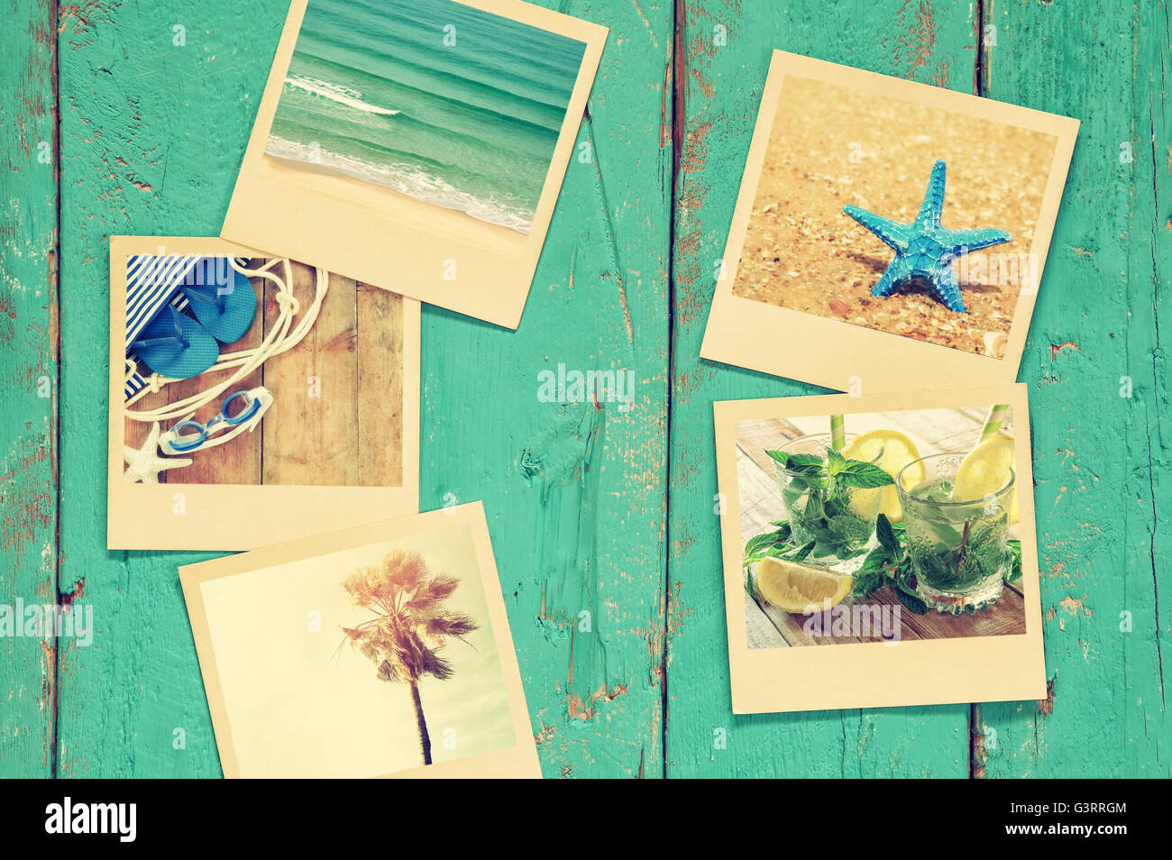 top view of instant polaroid photos album on wooden blue background ...