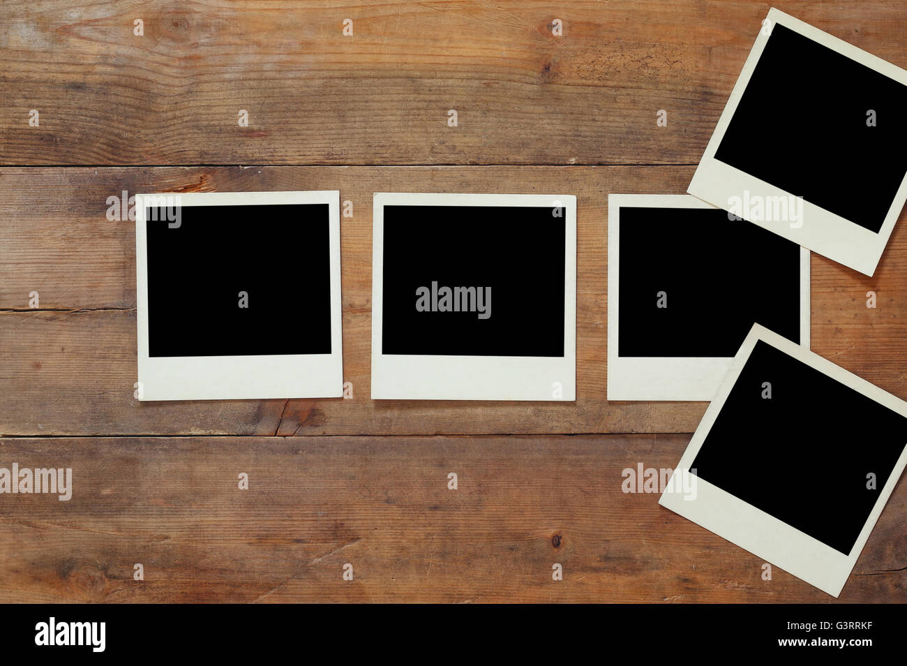 top view of blank instant photos album on wooden background. vintage ...