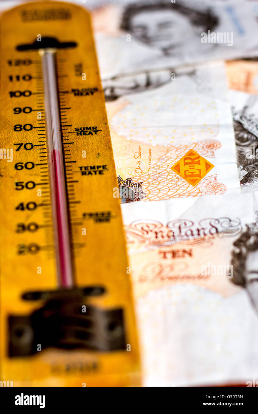 Thermometer and uk pound note depicting costs of global warming Stock ...