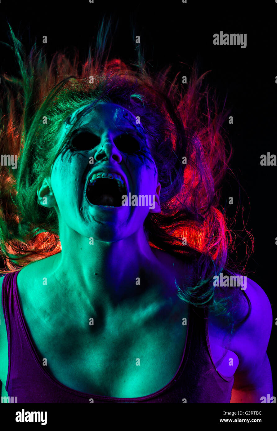 Terrifying shrieking gruesome female zombie witch Stock Photo - Alamy