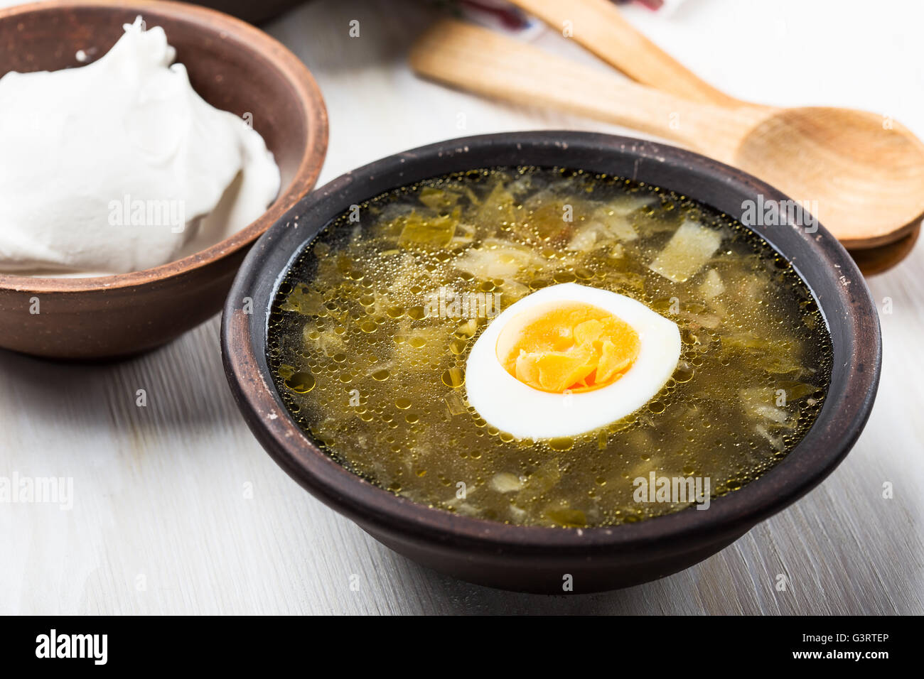 Spring greens borscht, sorrel spinach soup topped with boil egg garnish ...