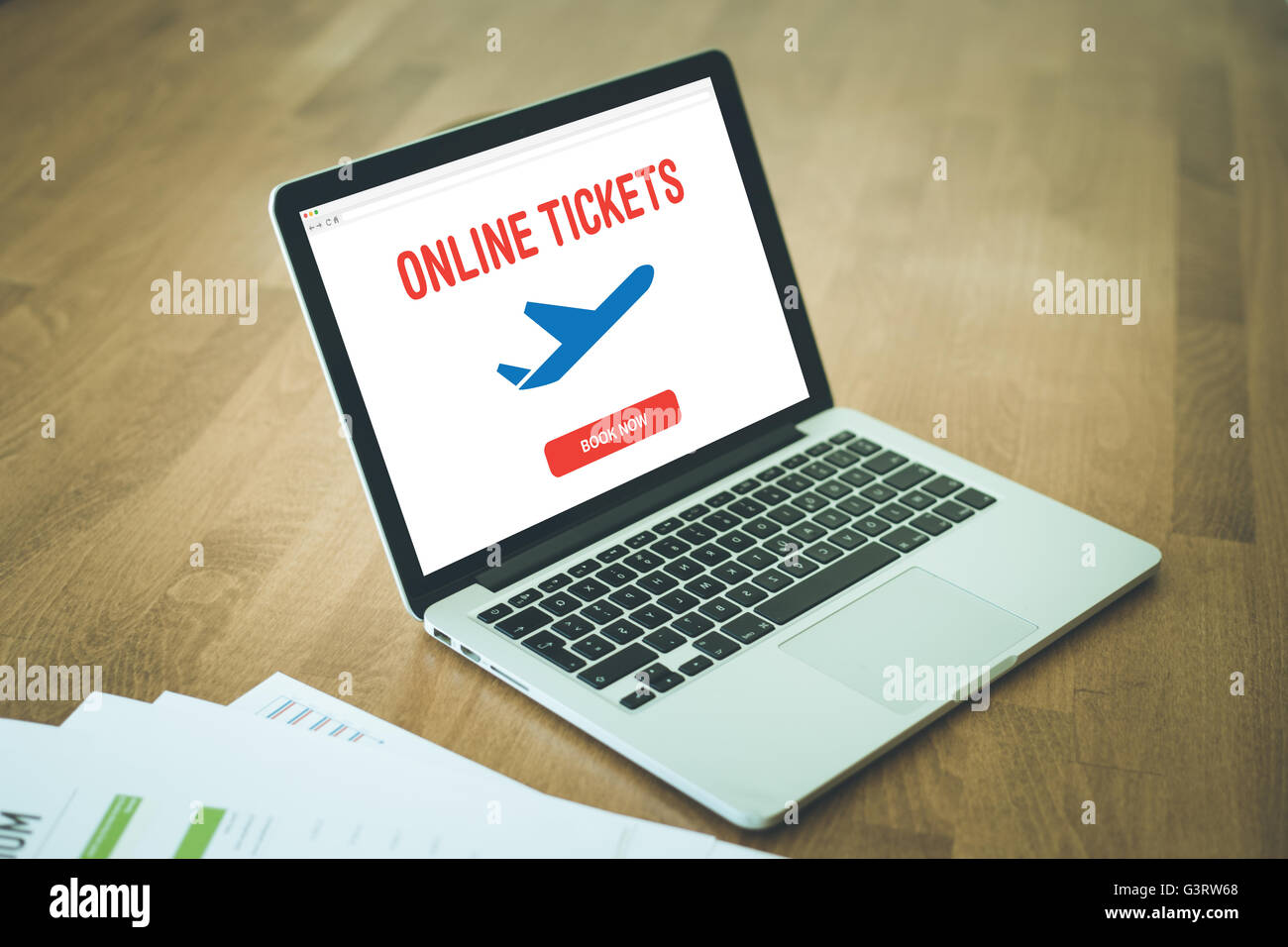 Buying airline tickets on computer Stock Photo - Alamy