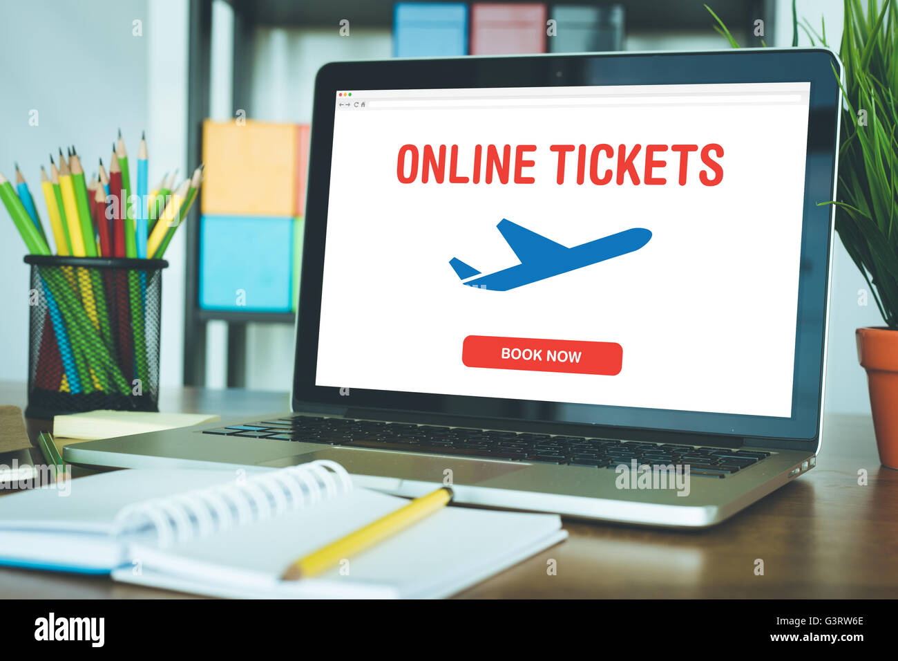 Buying airline tickets on computer Stock Photo - Alamy