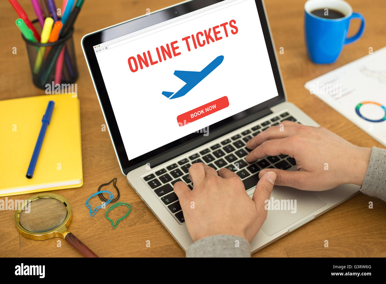 Buying airline tickets on computer Stock Photo - Alamy