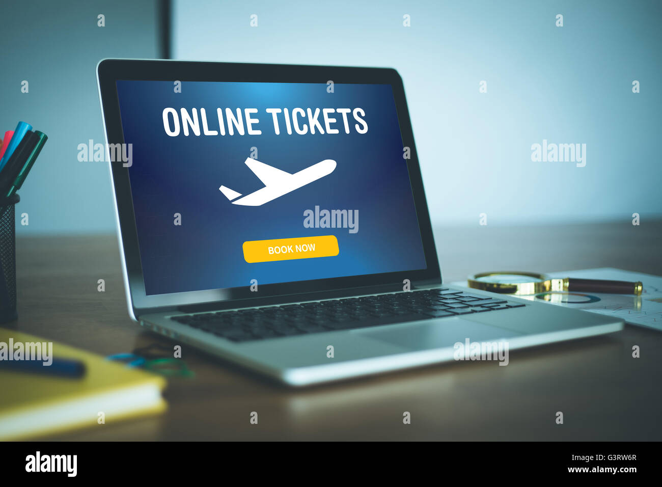 Buying airline tickets on computer Stock Photo - Alamy
