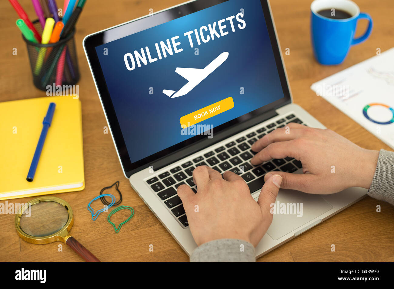 Buying airline tickets on computer Stock Photo - Alamy