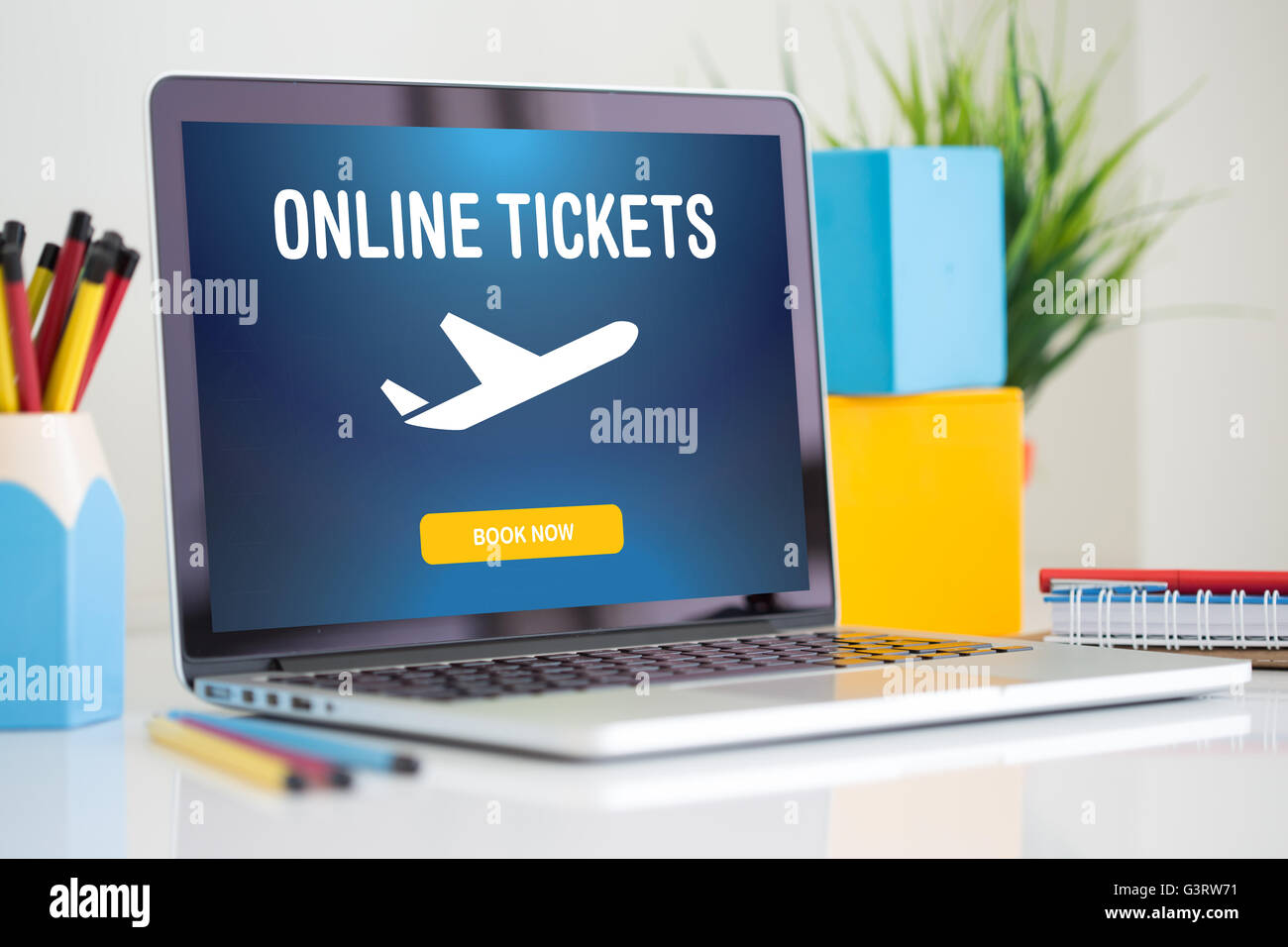 Buying airline tickets on computer Stock Photo - Alamy