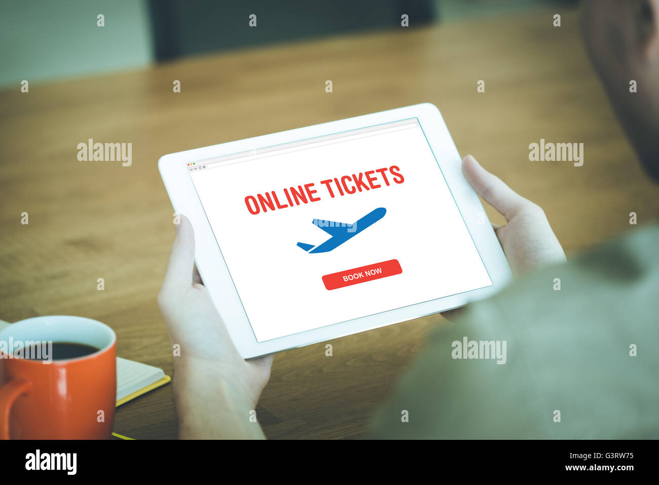 Buying airline tickets on computer Stock Photo - Alamy