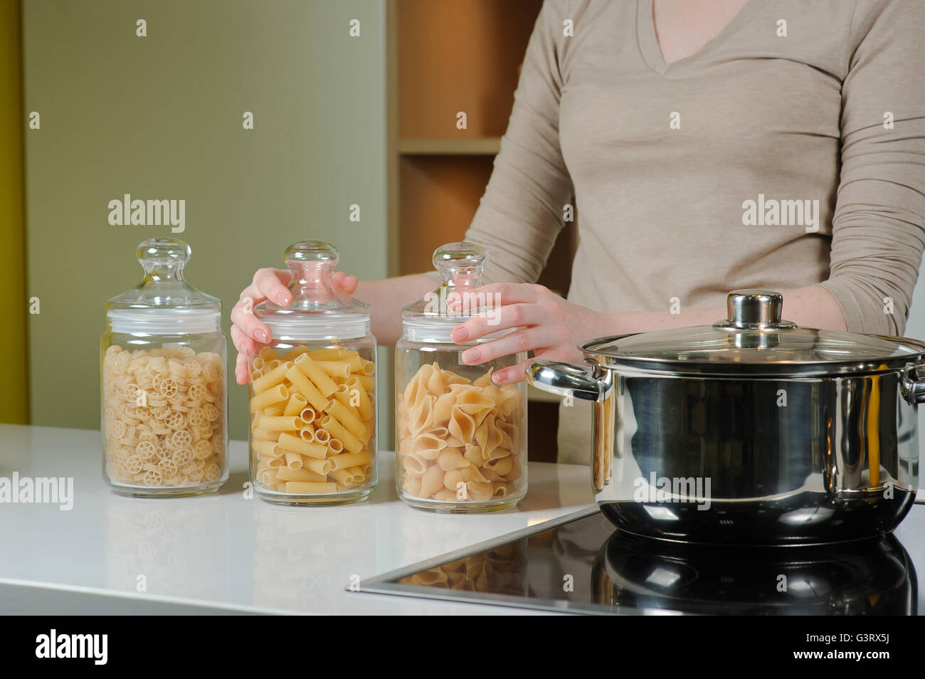 Three Glass jars for raw pasta Stock Photo - Alamy