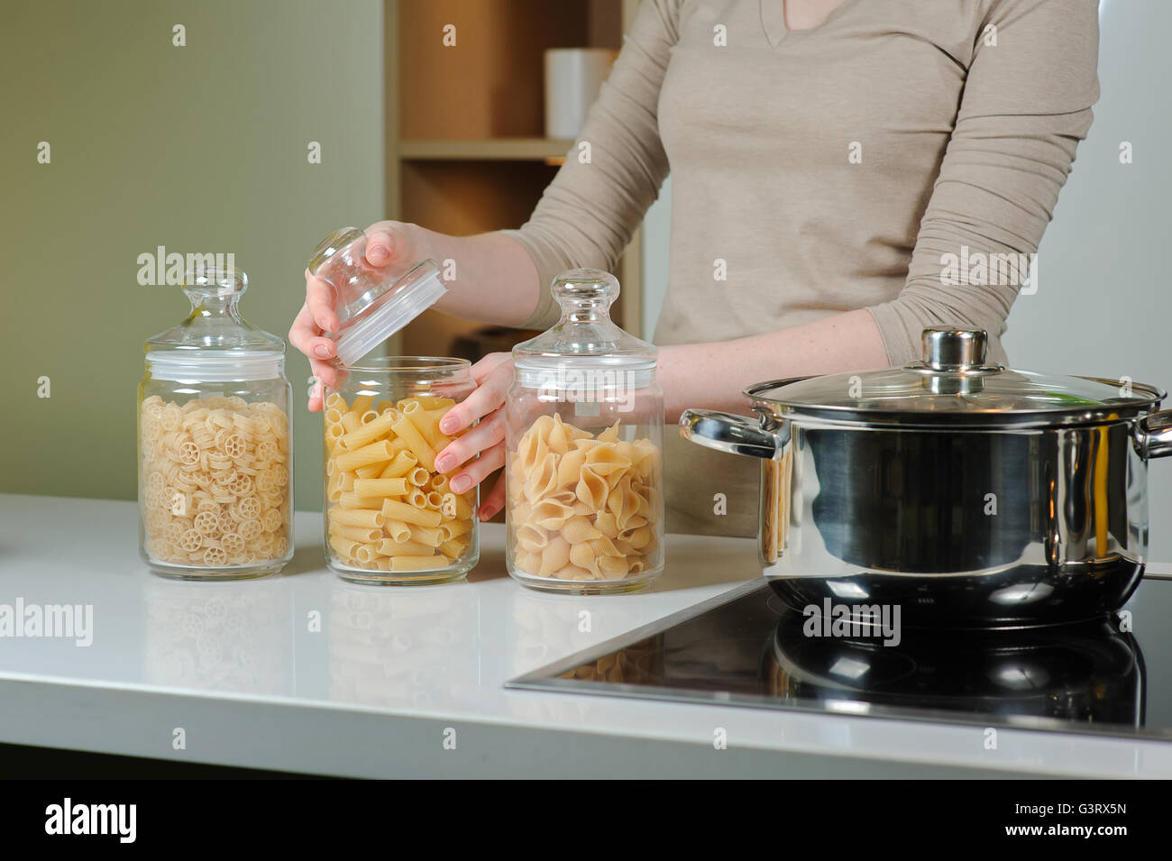 Glass jar for raw pasta Stock Photo - Alamy