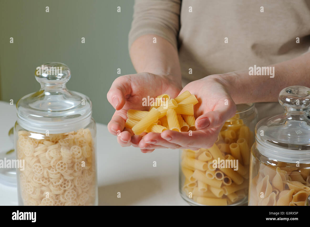 Handful of pasta Stock Photo - Alamy