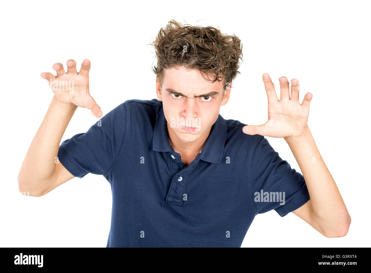 Angry teenage boy making faces isolated in white Stock Photo - Alamy