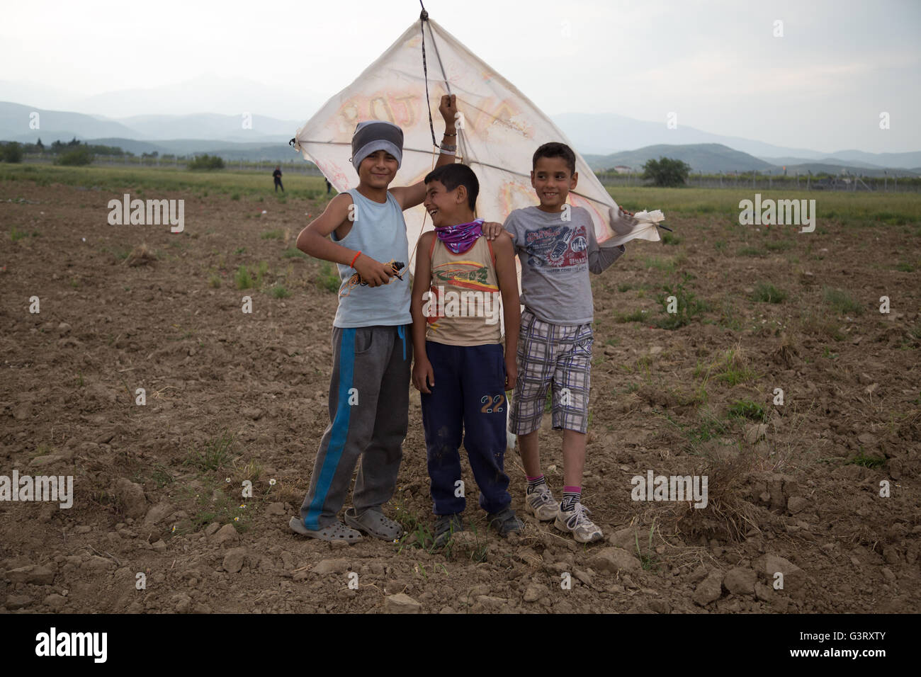 A group of young Syrian boys poses with a kite in the Idomeni Refugee ...