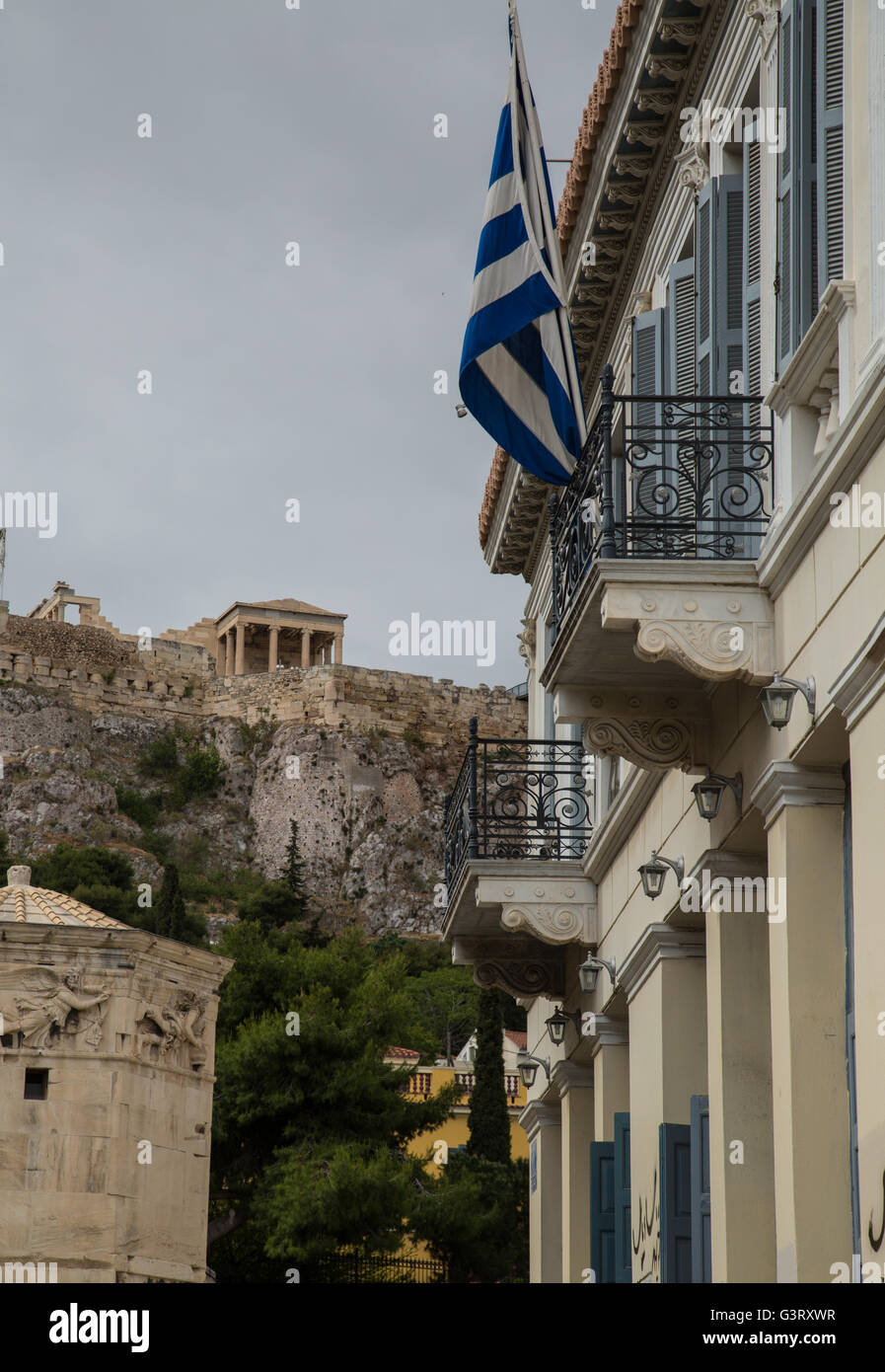 The Greek flag hanging off an Athens apartment building with the ...