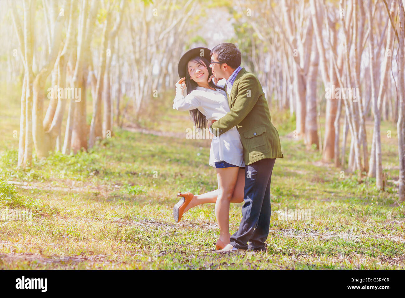 asai young romantic man and woman standing and hugging each other with ...