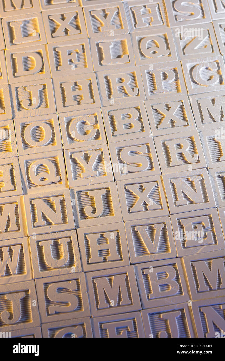 Alphabet bricks randomly place. Visual metaphor for concept of language ...