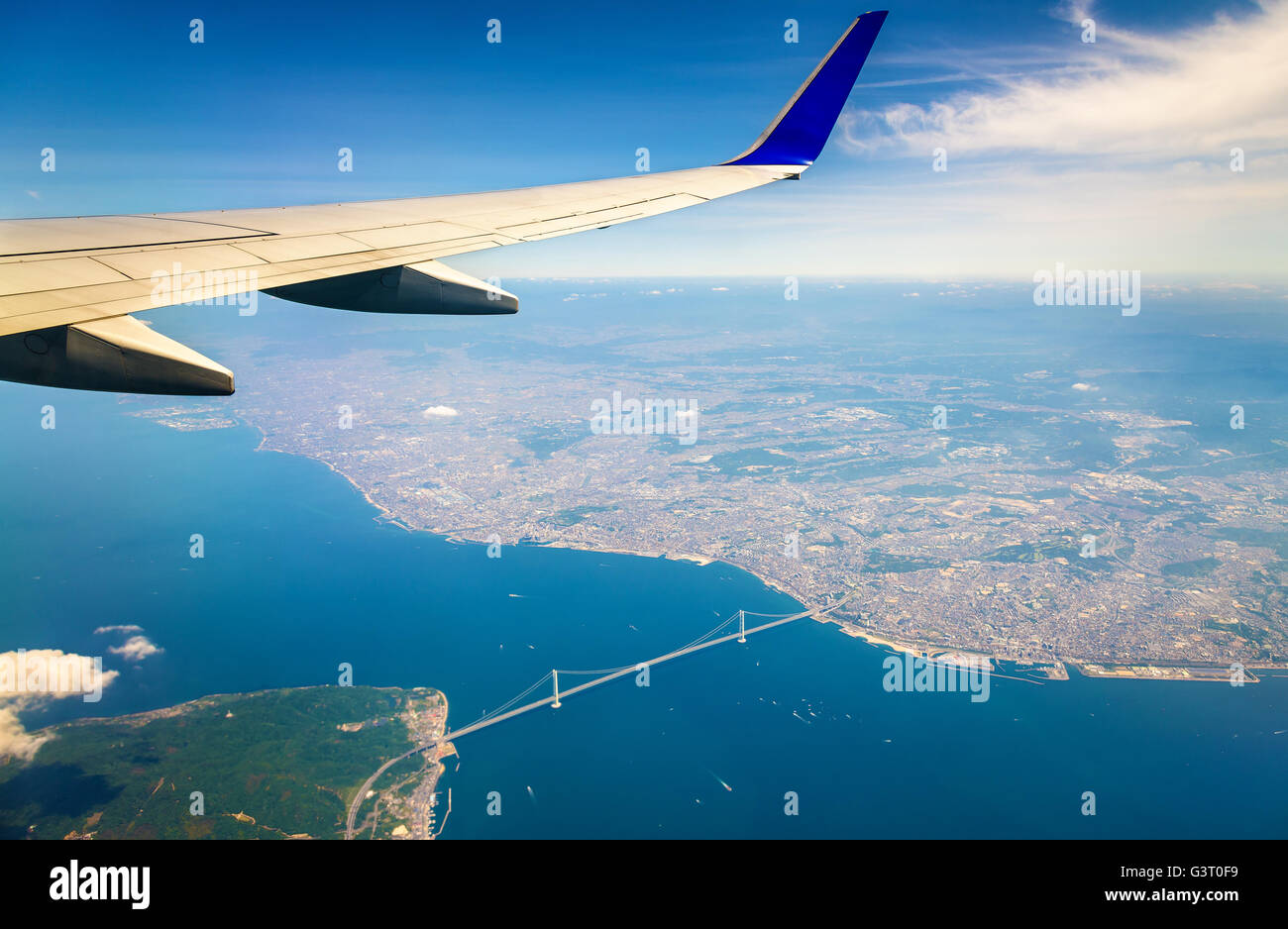 Flying above Japan, the Akashi Kaikyo Bridge seen through an airplane ...