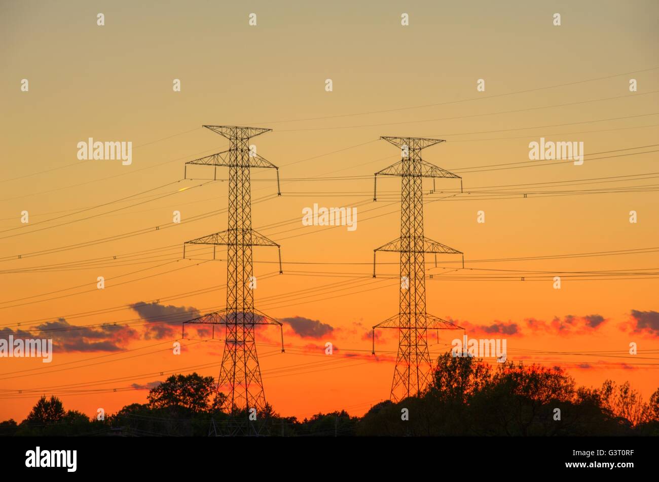 Electrical Pylons At Sunset Stock Photo - Alamy