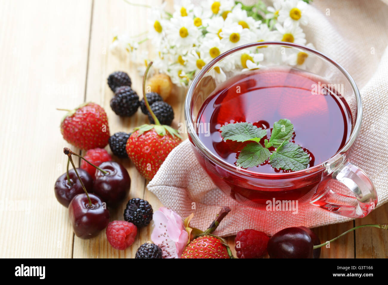 berry fruit tea in a glass cup Stock Photo - Alamy