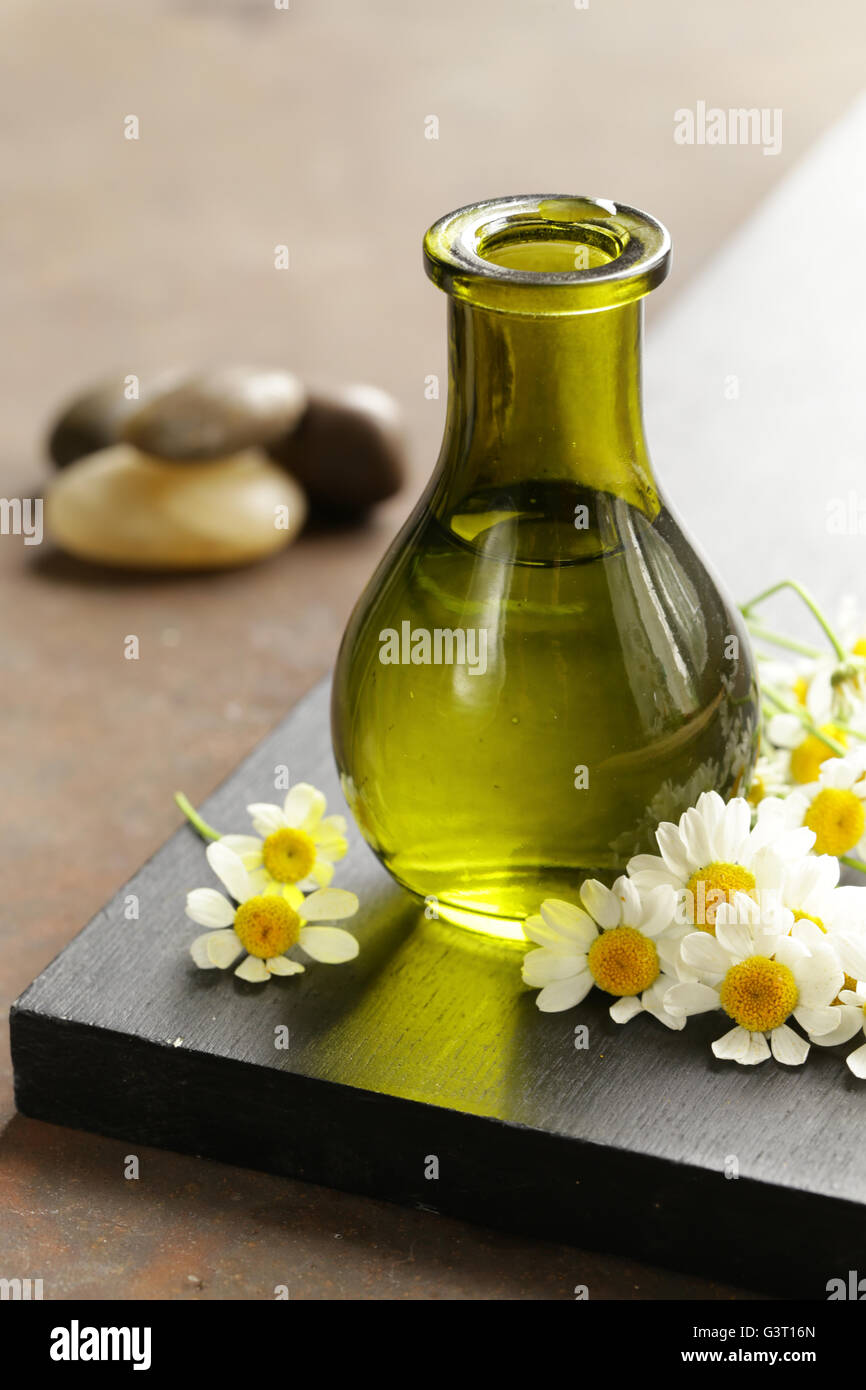 Natural organic herbal essence in a glass bottle Stock Photo - Alamy