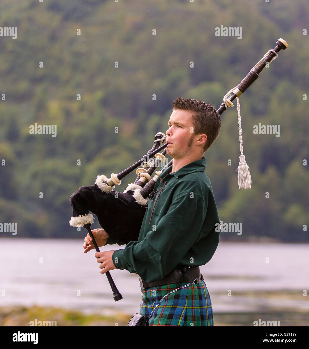 Young man playing the bagpipes hi-res stock photography and images - Alamy