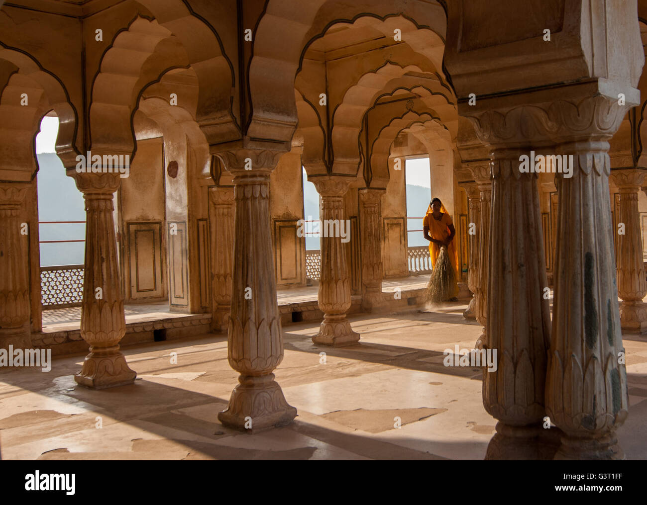 A woman clean a portico of a palace in India Stock Photo - Alamy