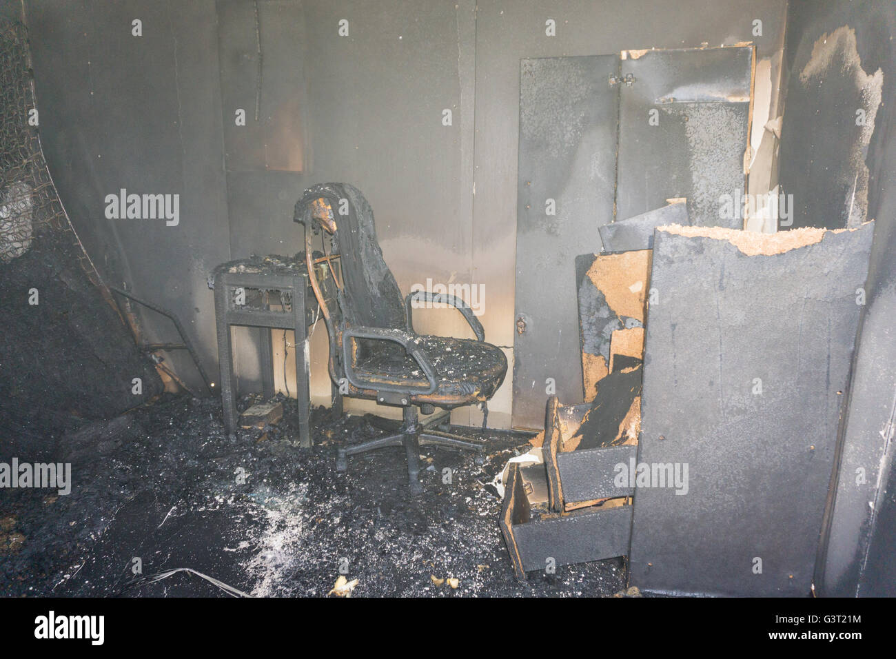 chair and furniture in room after burned by fire with smoke and dust in ...