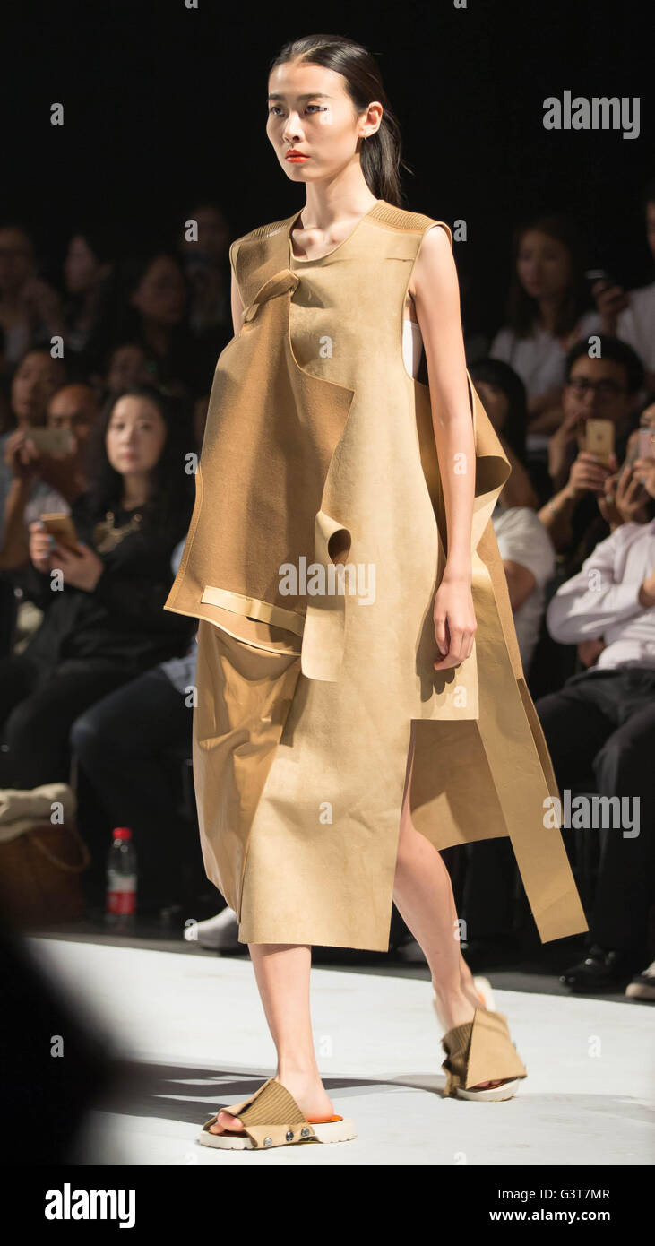 Beijing, China. 14th June, 2016. A model presents a creation designed ...