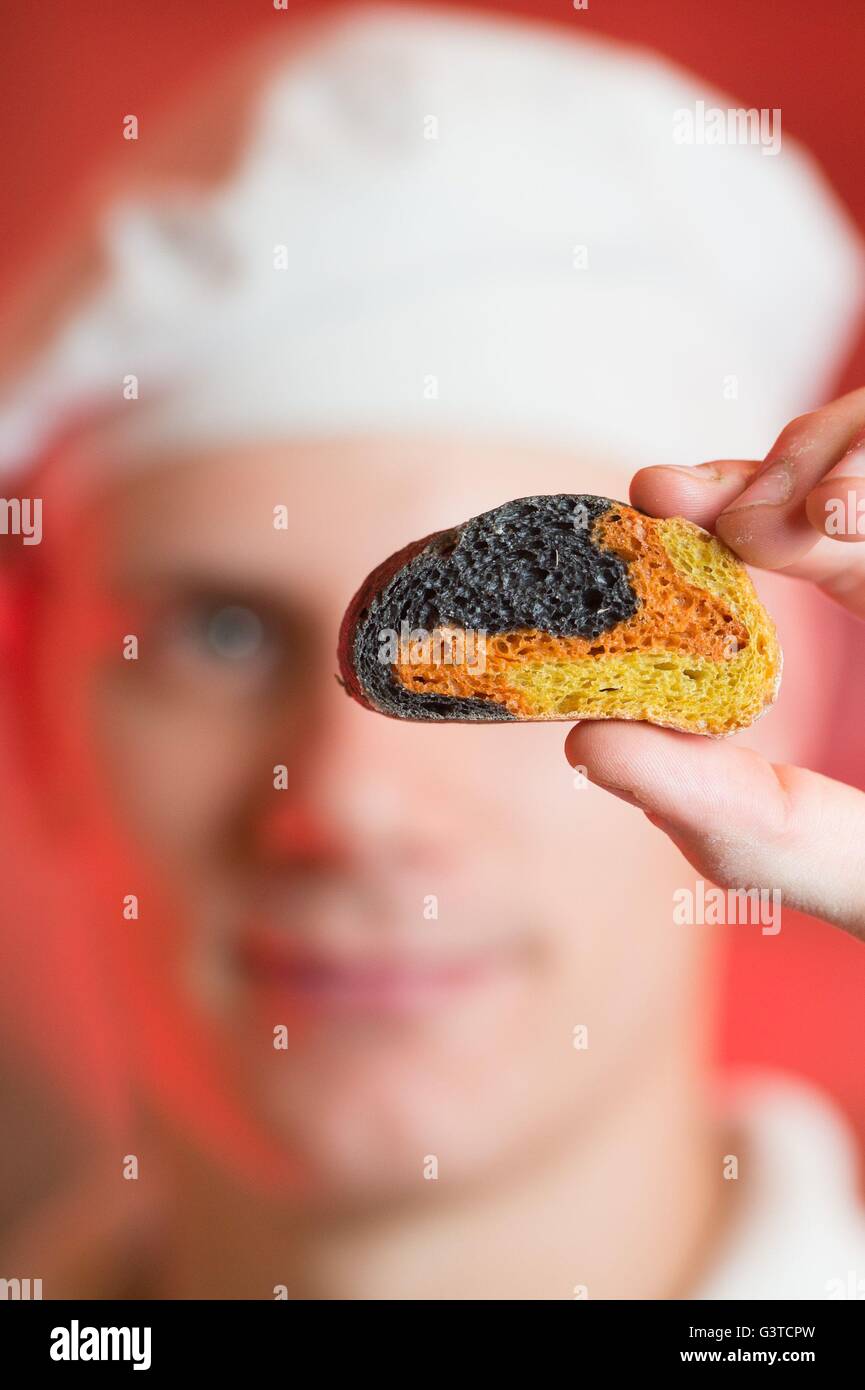 Master baker Marco Simon holds up a slice of European Champion breads ...