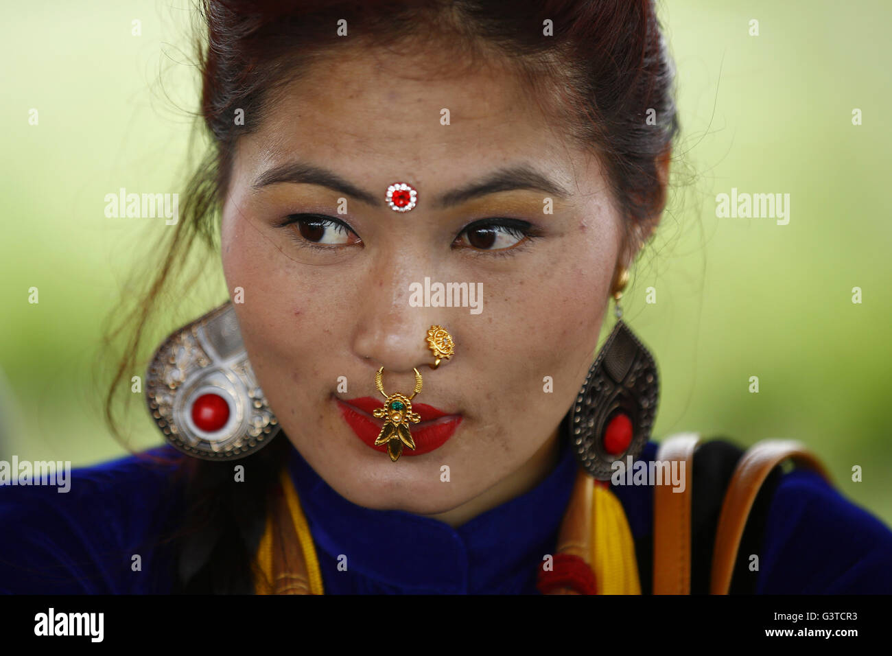 Kathmandu, Nepal. 15th June, 2016. A Nepalese woman looks on during ...