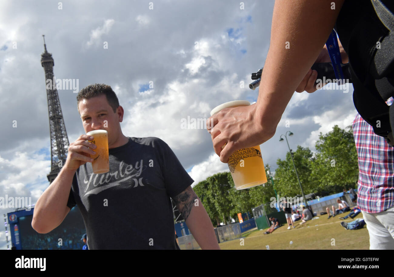 Paris, France. 15th June, 2016. A soccer fan drinks beer from a plastic ...