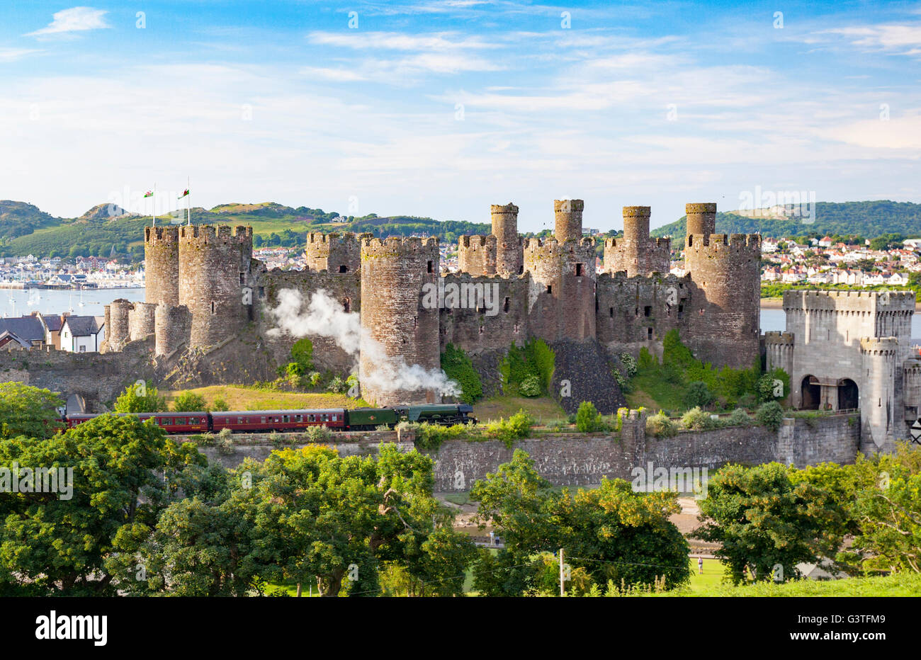 The Flying Scotsman Steam Train passing the medieval fortress of Conwy ...