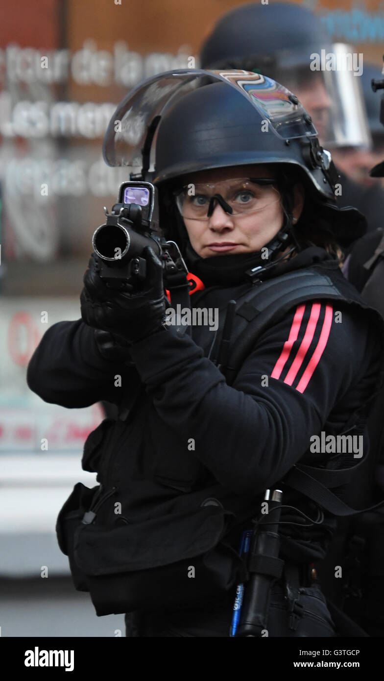 Lille, France. 15th June, 2016. A French police woman takes aim with a ...