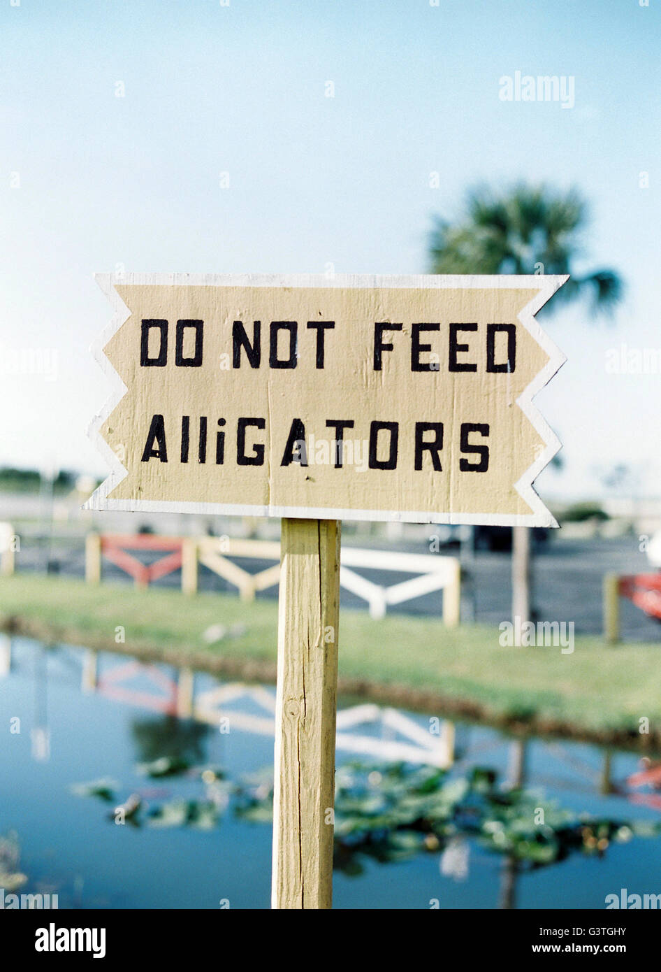 USA, Florida, Sanibel Island, Warning sign on wooden pole Stock Photo ...