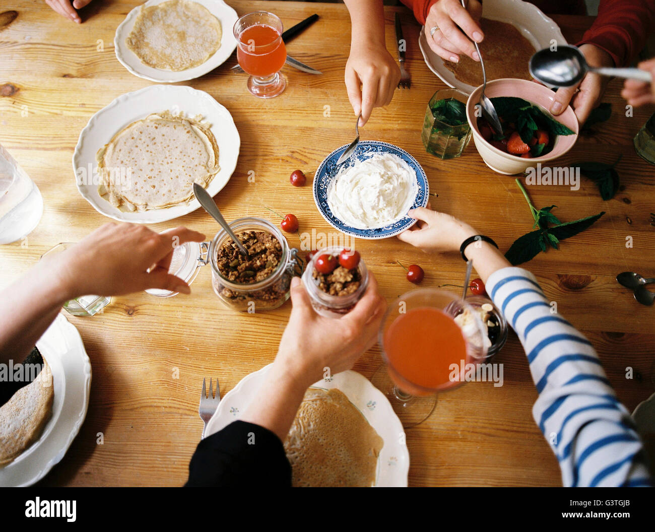 Sweden, People eating breakfast at table Stock Photo - Alamy