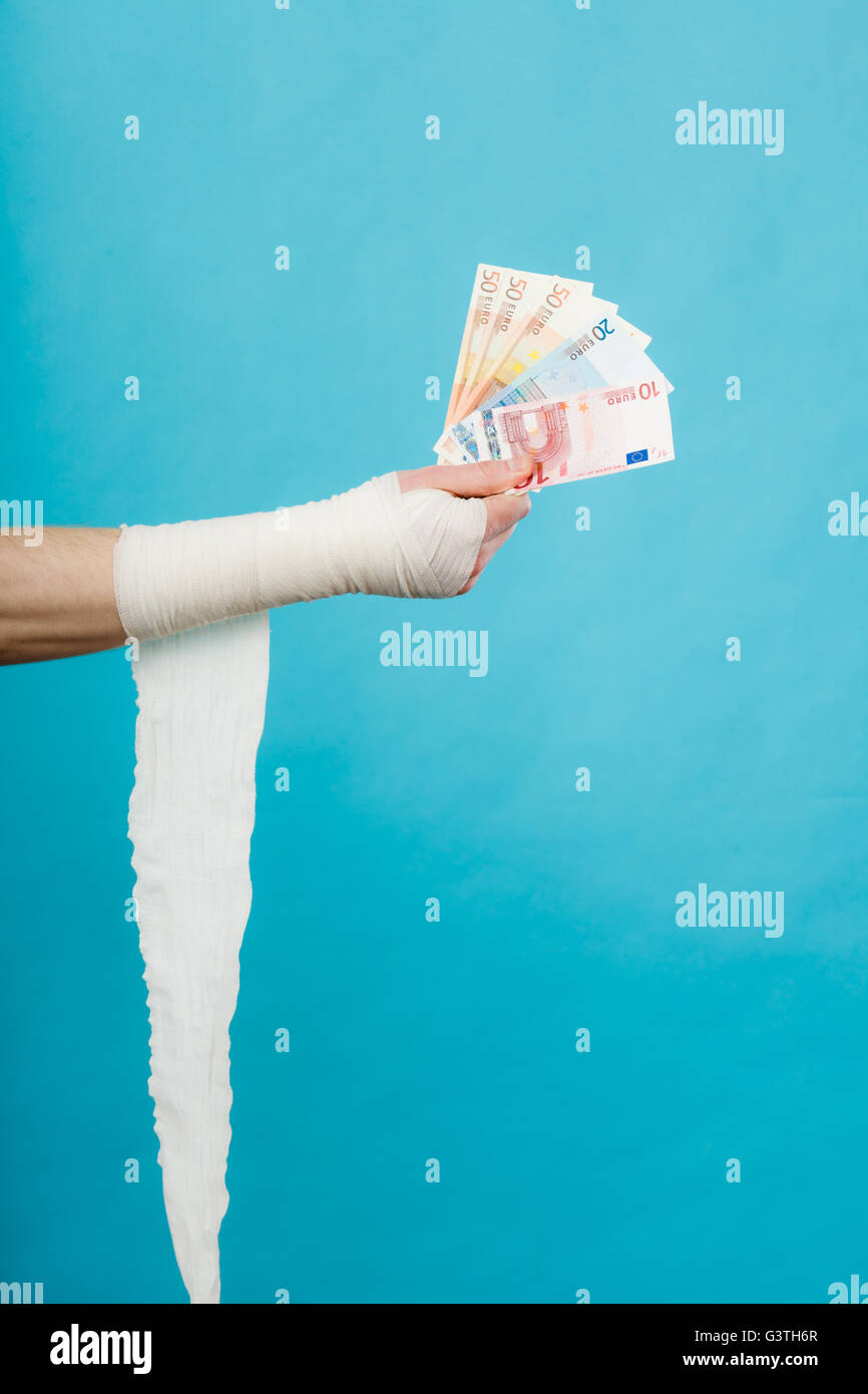 Corruption in healthcare industry. Part body male bandaged hand with ...