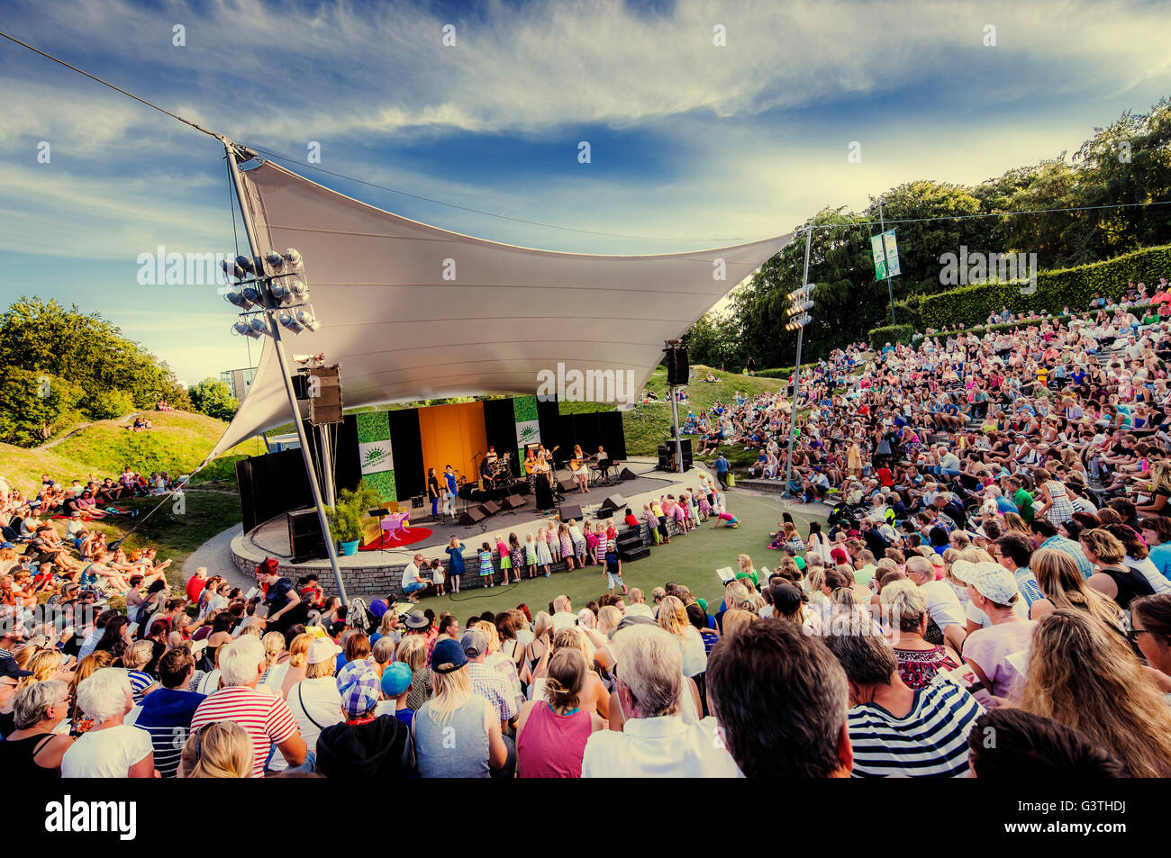 Watching an outdoor performer High Resolution Stock Photography and ...