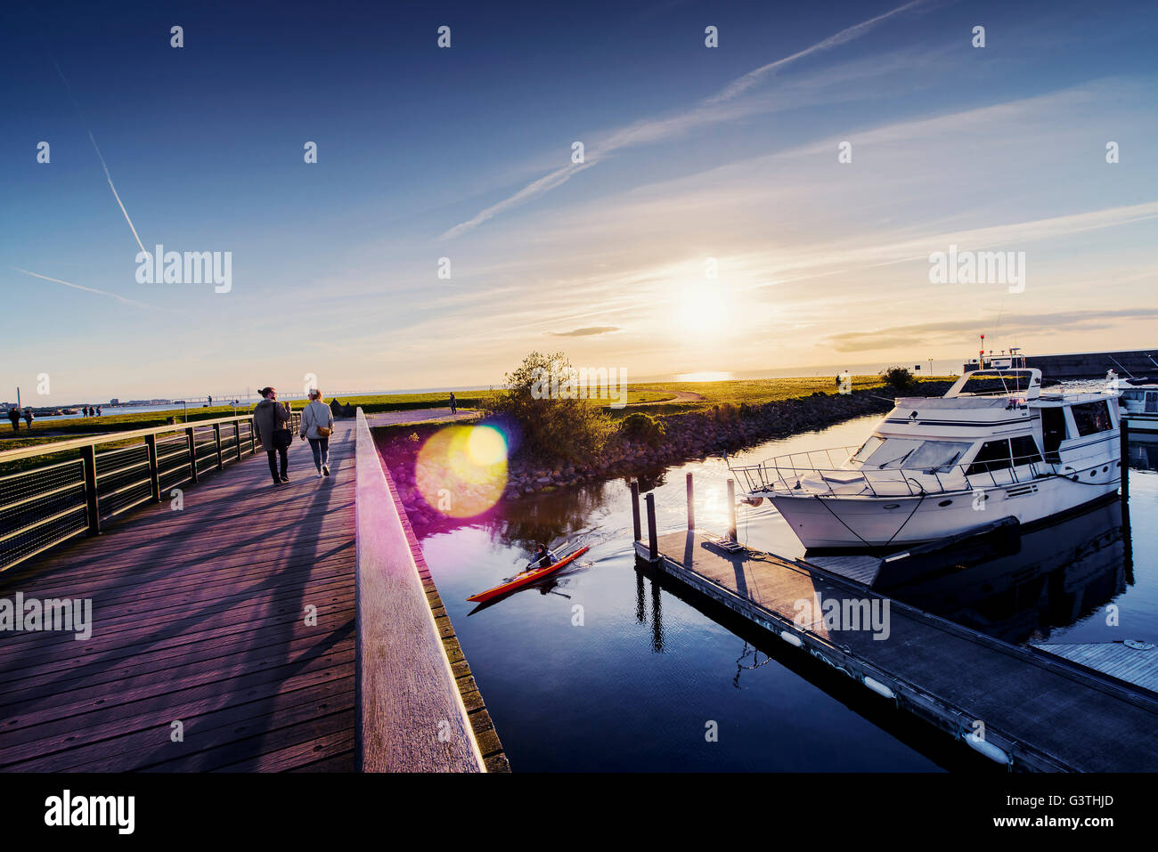 Two women going into the sea hi-res stock photography and images - Alamy