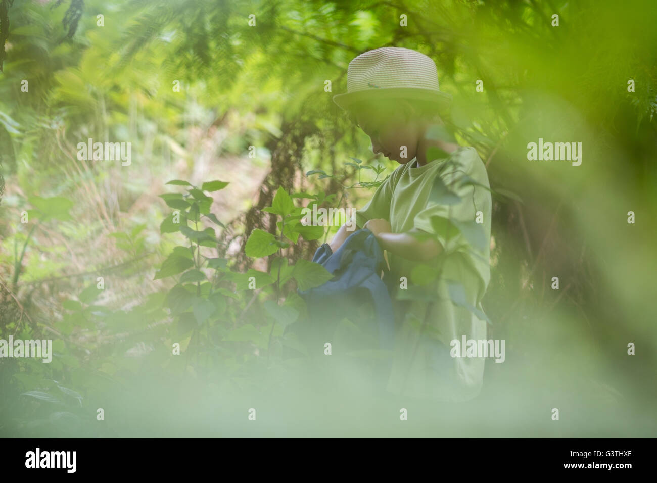Little boy checking his bag Stock Photo - Alamy