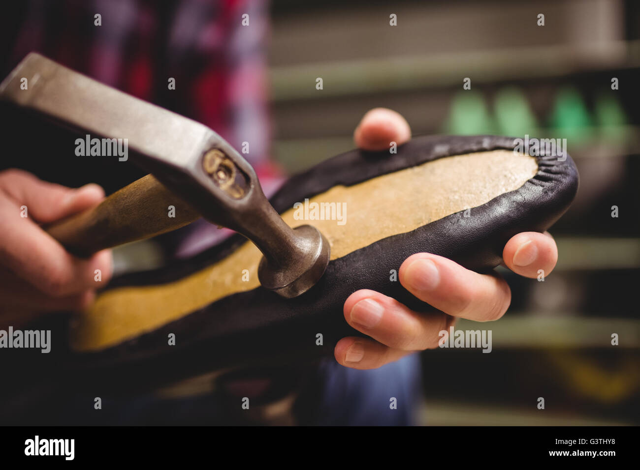 Close up of cobbler making shoes with a hammer Stock Photo - Alamy