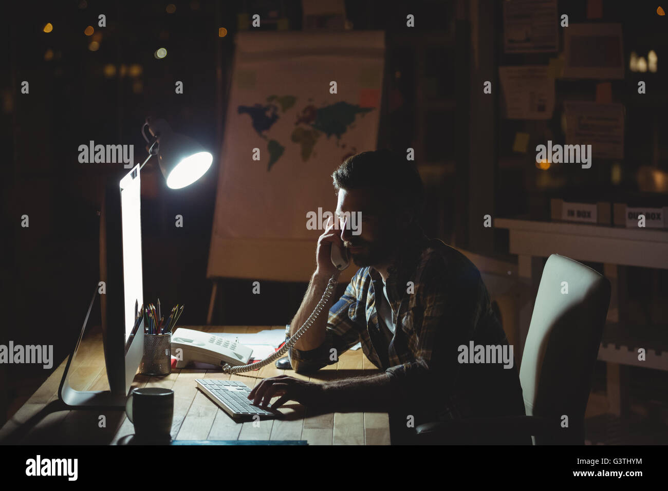 Businessman making a phone call at night Stock Photo - Alamy