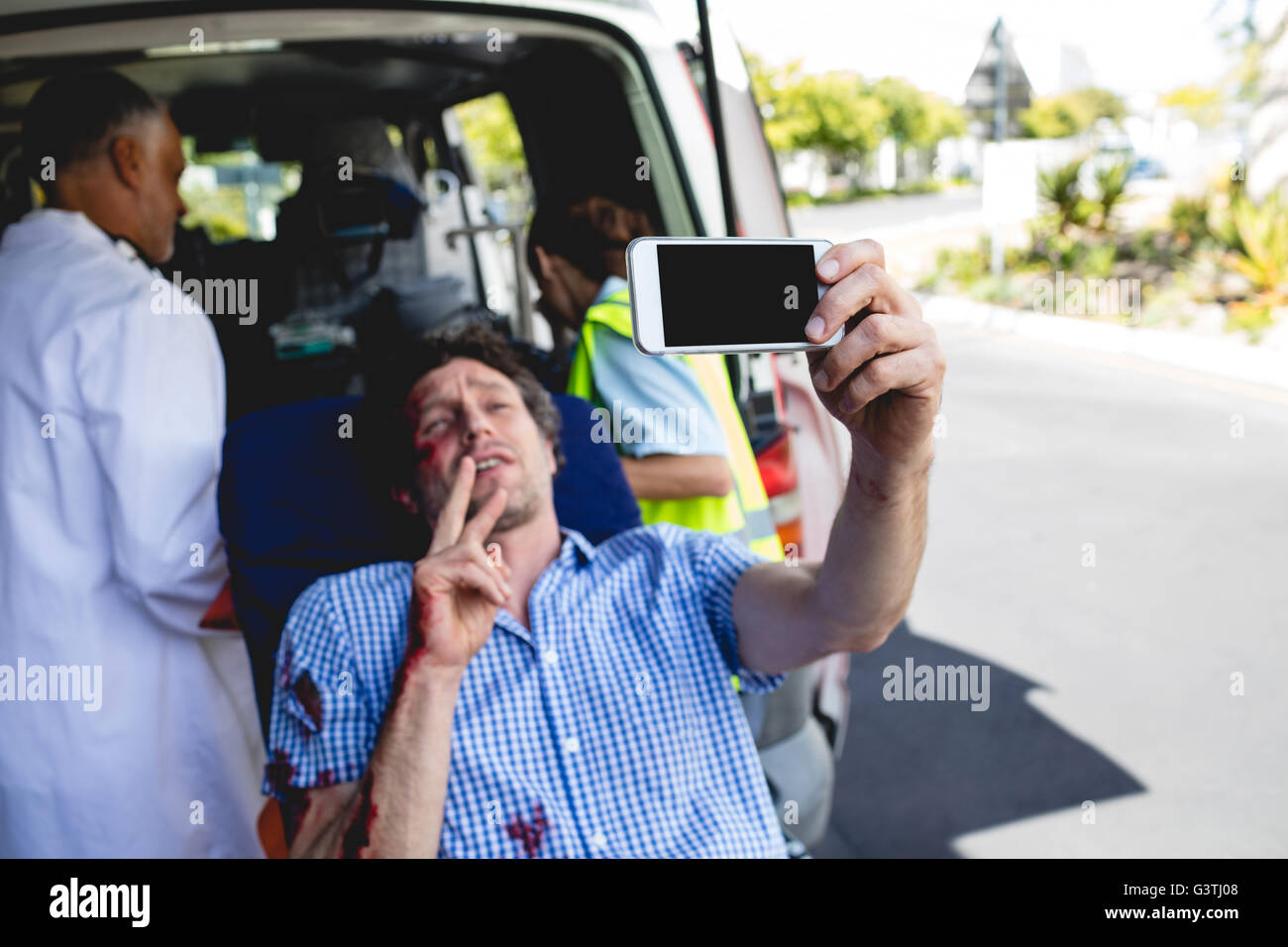Injured man taking selfie Stock Photo - Alamy
