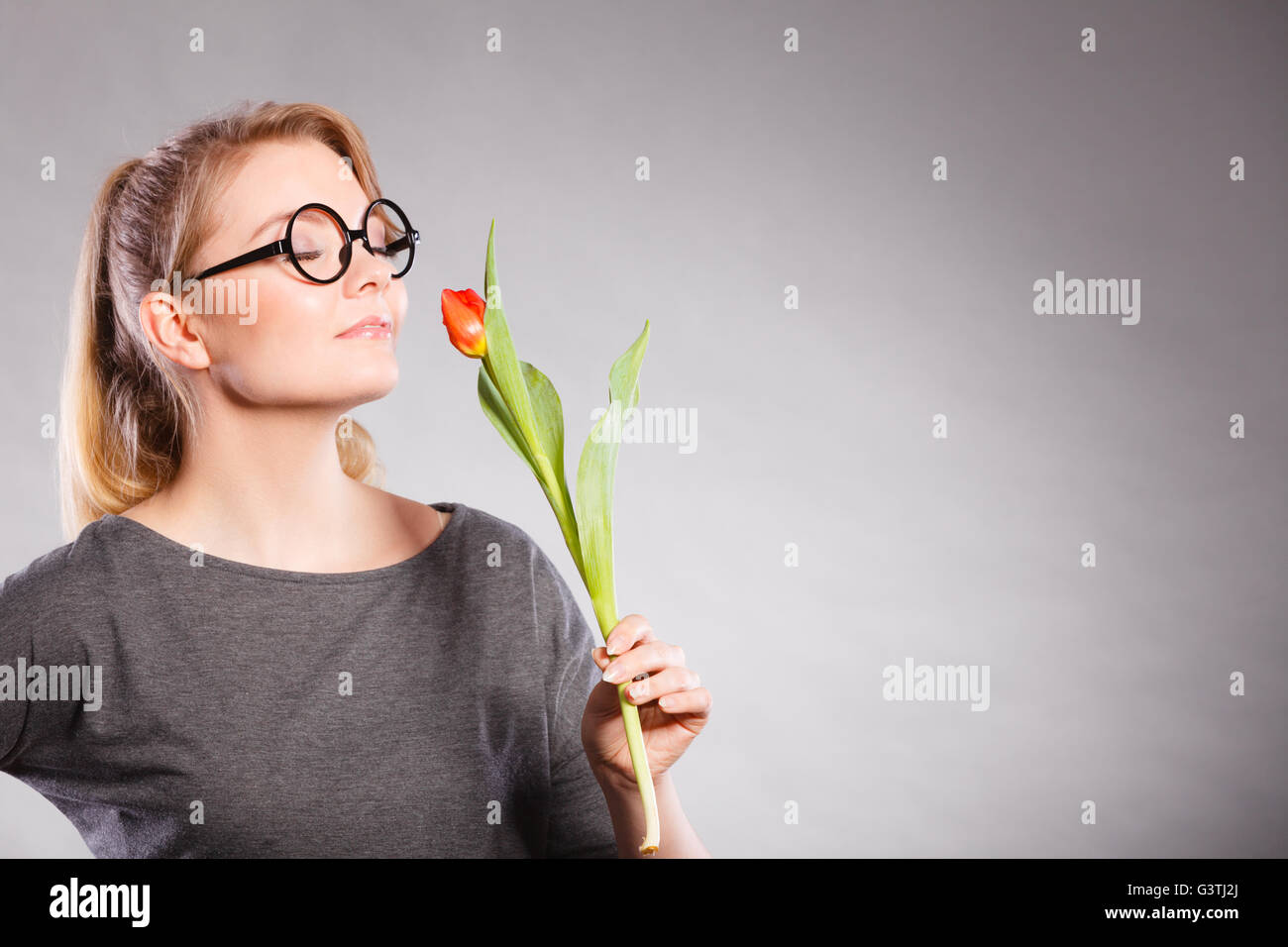 Peace and content. Beauty adorable girl smelling beautiful spring ...