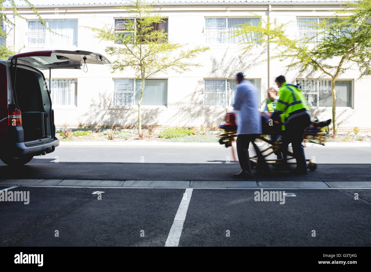 Man and carrying injured woman hi-res stock photography and images - Alamy